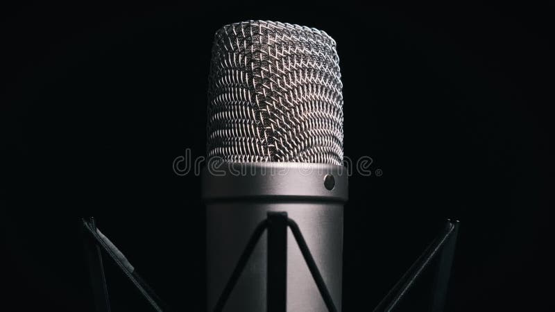 The Studio Condenser Microphone Rotates on a Black Background Close-Up ...