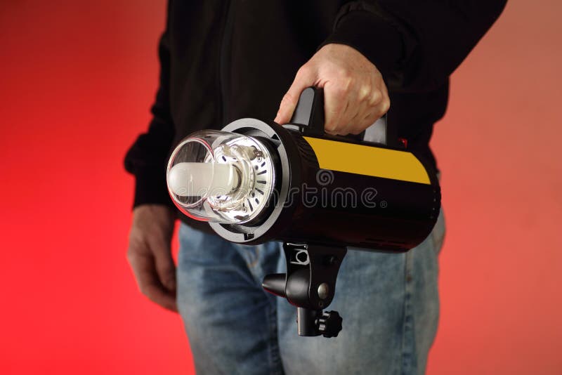 Studio Flash in a Person`s Hand Stock Photo - Image of modifier ...
