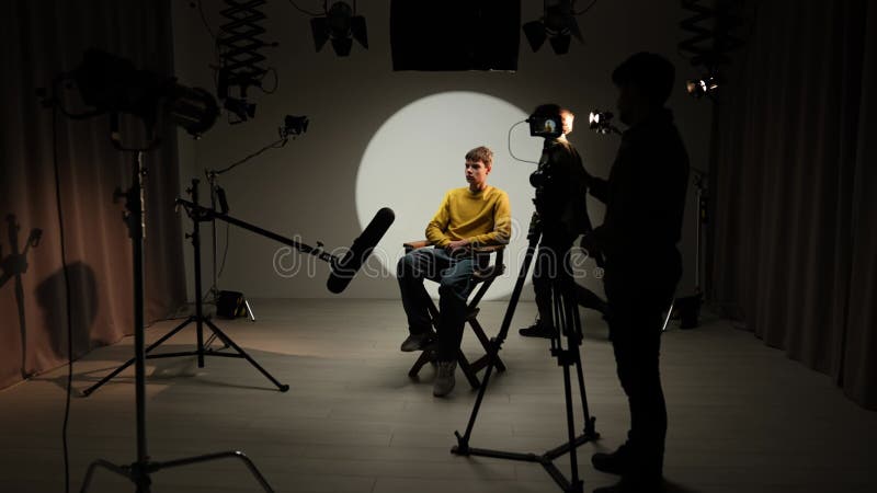 Studio for Photo Video Production with Lighting Equipment and Cyclorama, Team Members Preparing ...