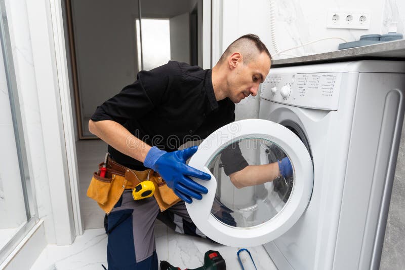 Studio Photo of Washing Machine Repairman Stock Photo - Image of hand ...
