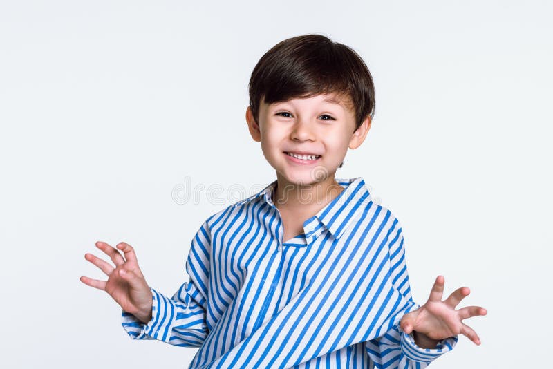 Studio Portrait of a Boy Staring at the Camera and Acting Up Stock ...
