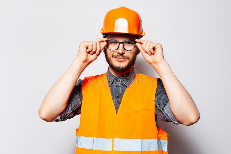 Studio Portrait of Confident Construction Worker. Holding Glasses with ...