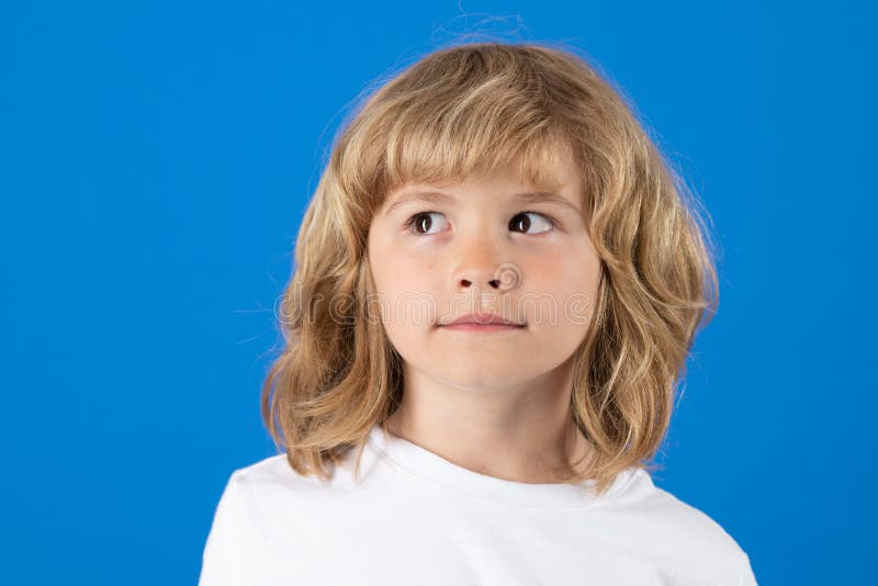 Studio Portrait of Cute Kid Boy Looking Away on Blue Isolated ...