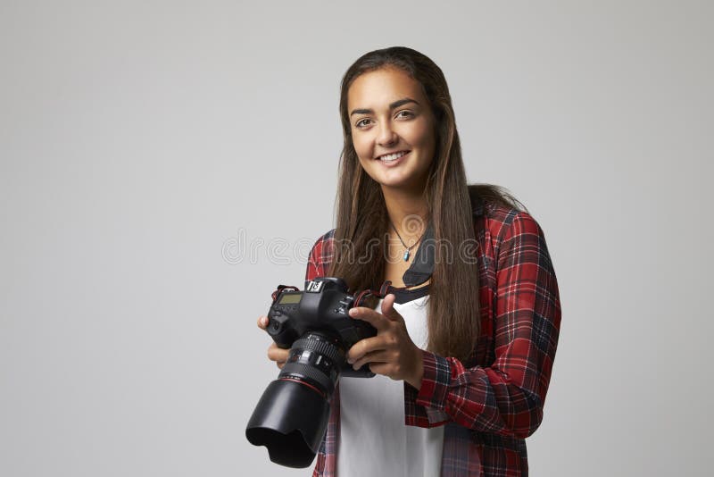 Studio Portrait of Female Photographer with Camera Stock Photo - Image ...
