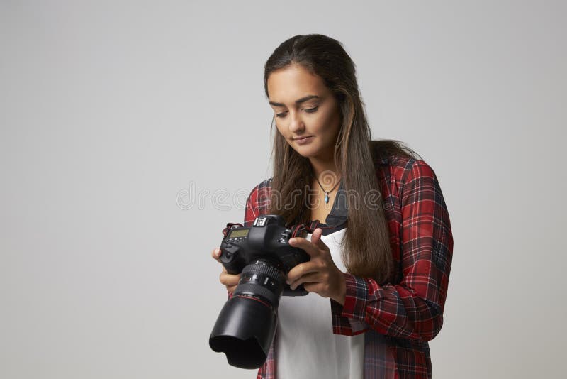 Studio Portrait of Female Photographer with Camera Stock Image - Image ...