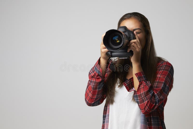 Studio Portrait of Female Photographer with Camera Stock Photo - Image ...