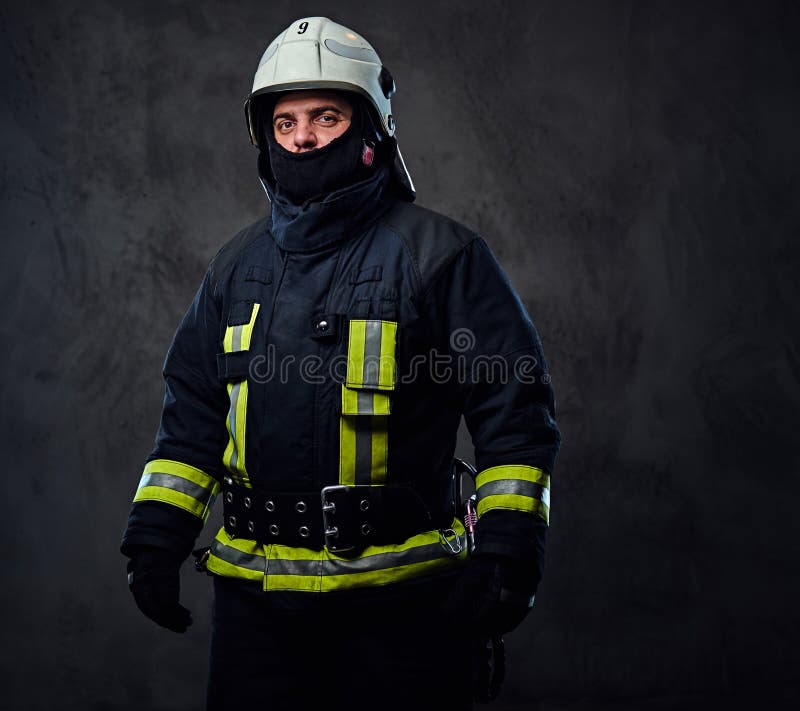 Studio Portrait of Firefighter Dressed in Uniform. Stock Image - Image ...