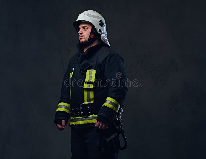 Studio Portrait of Firefighter Dressed in Uniform. Stock Image - Image ...