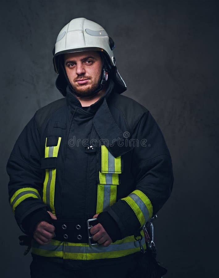 Studio Portrait of Firefighter Dressed in Uniform. Stock Image - Image ...