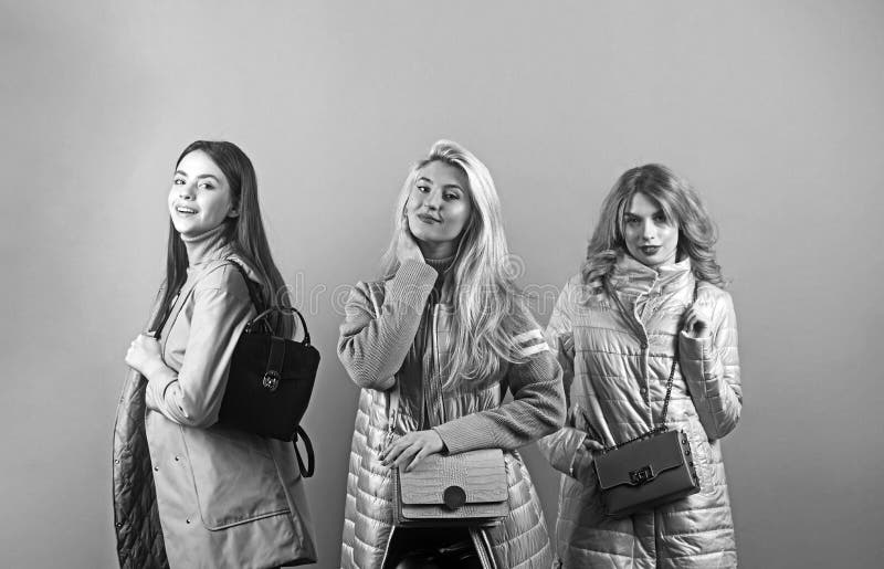 Studio Portrait of a Group of Three Young Beautiful Model Smiling and ...