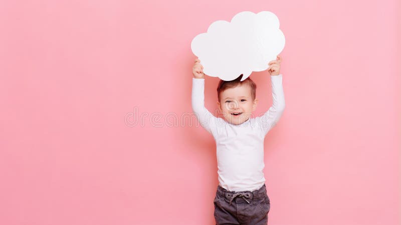 Studio Portrait of a Happy Boy with a Clean White Board in the Shape of ...