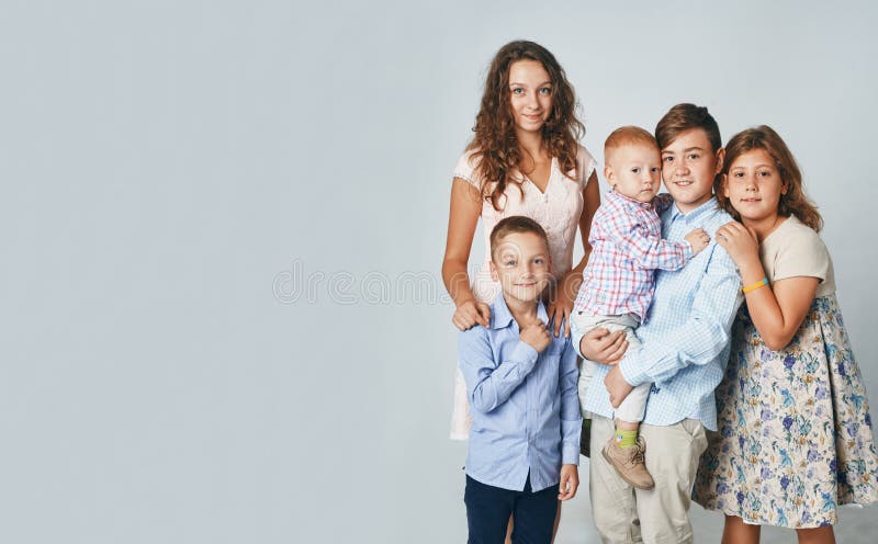 A Studio Portrait of Happy Children of All Ages Stock Photo - Image of ...