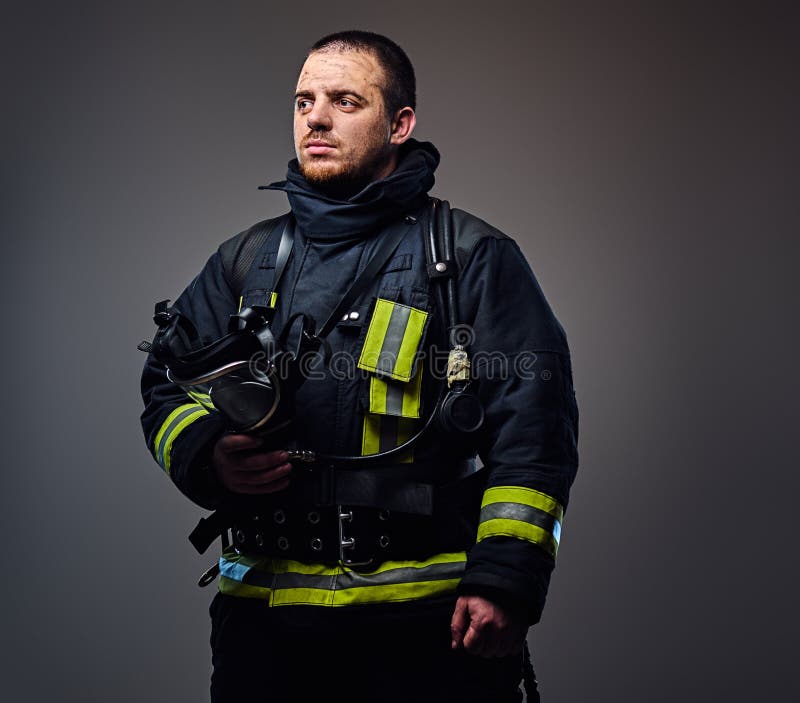 Studio Portrait of a Male Dressed in a Firefighter Uniform. Stock Photo ...