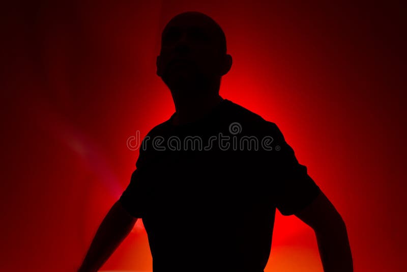 Man in Silhouette, Standing Still and Shirtless, Posing for a Photo ...