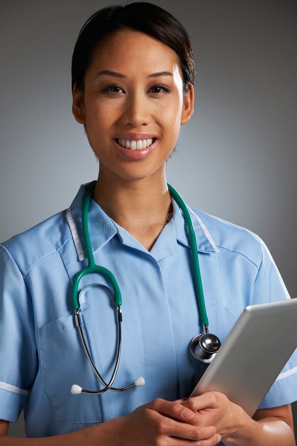 Studio Portrait of Nurse with Digital Tablet Stock Photo - Image of ...