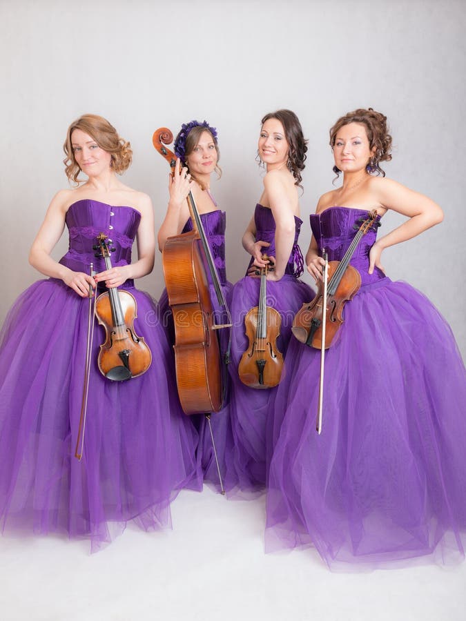 Studio Portrait of a Quartet Stock Photo - Image of dress, quartet ...