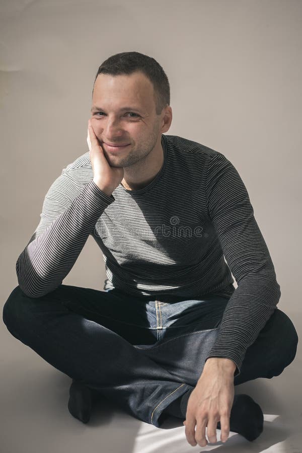 Studio Portrait of Sitting Young European Man Stock Image - Image of ...
