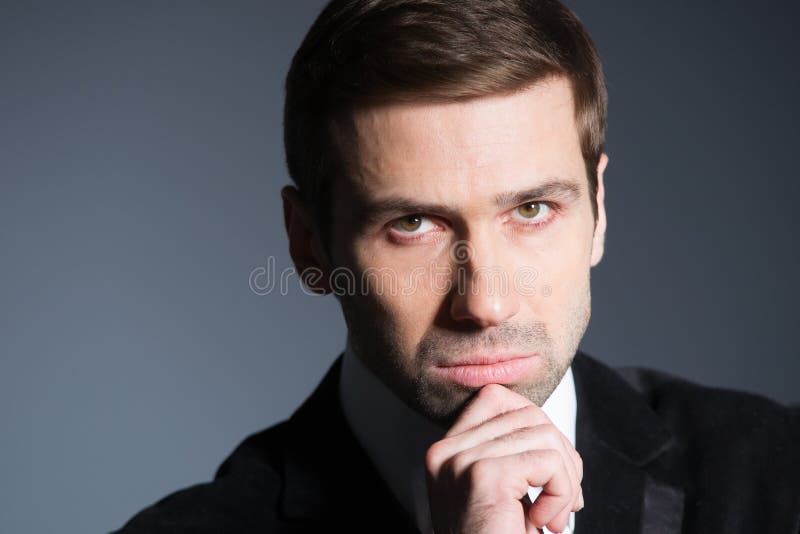 Studio Portrait of Thinking Young Business Man. Stock Photo - Image of ...