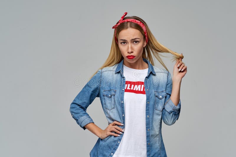 Studio Portrait of a Young Attractive Woman with a Upset Expression ...