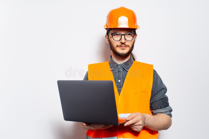 Studio Portrait of Young Confident Construction Worker on White, Using ...