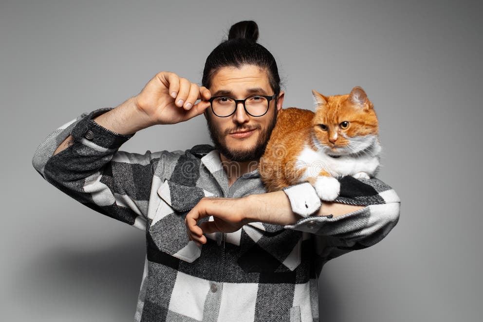 Studio Portrait of Young Confident Man with Red Cat on His Arm Stock ...