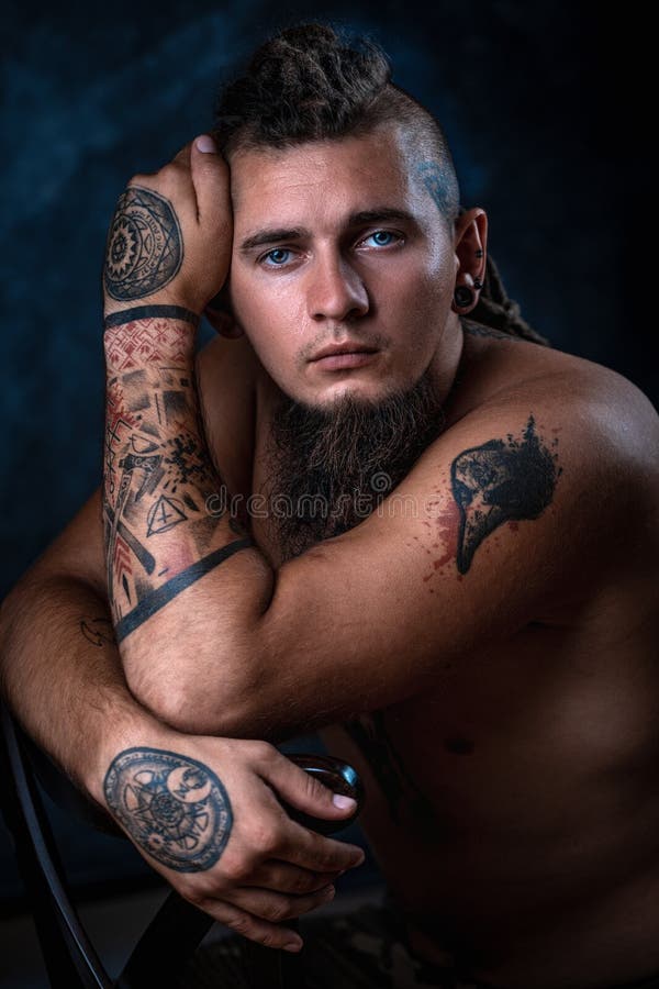 Studio Portrait of a Young Man with Tattoos Stock Photo - Image of ...