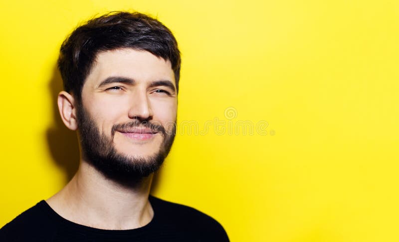 Studio Portrait of Young Smiling Guy on Yellow Background with Copy ...