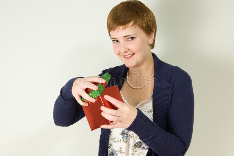 Studio Portrait of Young Woman Holding Gift Box Stock Image - Image of ...