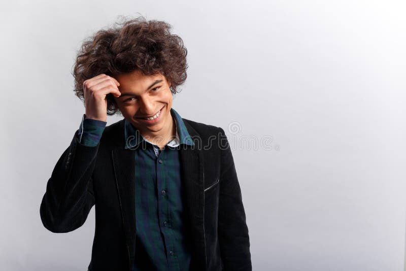 Horizontal View of a Smiling Young Boy in Jacket with Hide Face because ...