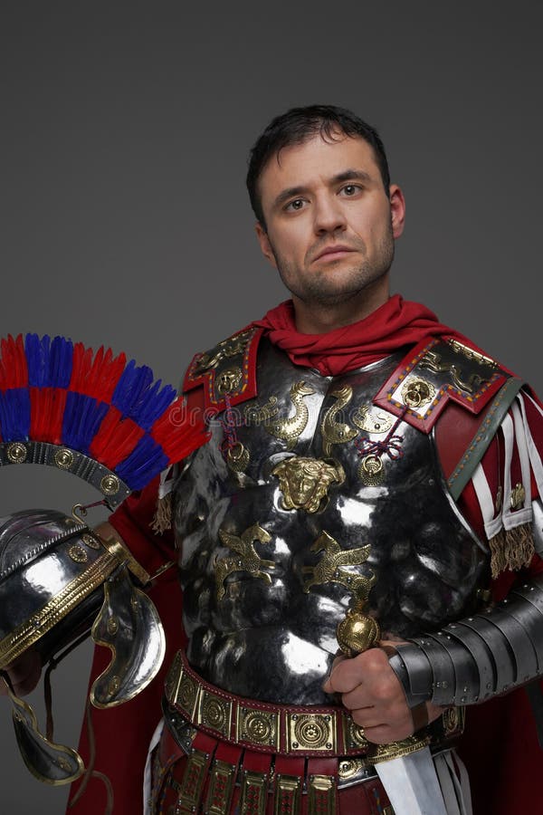 Powerful Roman Centurion with Plumed Helmet Isolated on Gray Stock ...