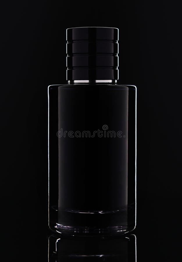 Studio Shot of Dark Glass Perfume Bottle on Black Background with ...