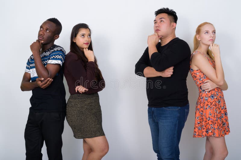 Studio Shot of Diverse Group of Multi Ethnic Friends Thinking To Stock ...