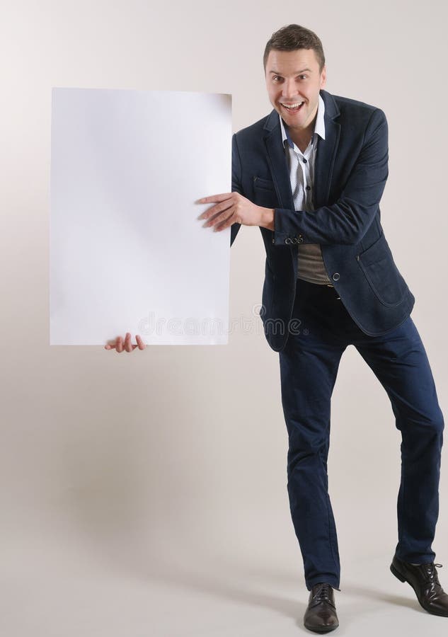 Studio Shot of a Exciting Man in a Suit Holding Up a Blank Sheet Stock ...