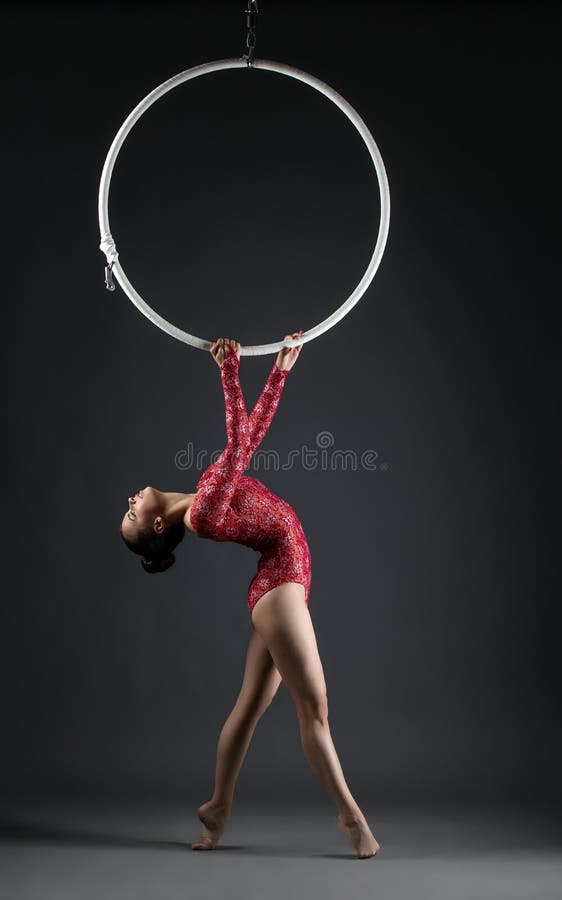 Graceful Acrobat Performs Gymnastic Trick on Hoop Stock Image - Image ...