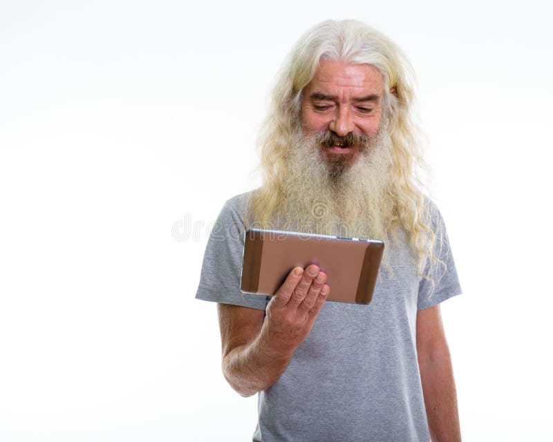 Studio Shot of Happy Senior Bearded Man Smiling while Using Digi Stock ...