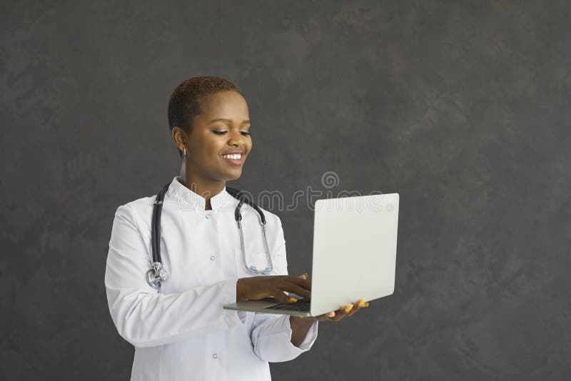 Happy Smiling Black Female Doctor Using Laptop Computer Isolated on ...