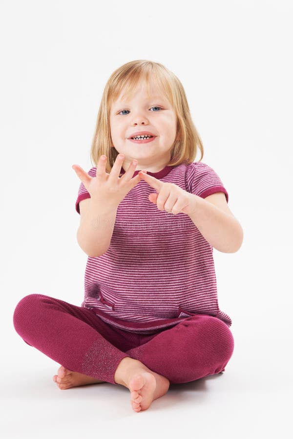 Studio Shot of Little Girl Counting on Fingers Stock Image - Image of ...
