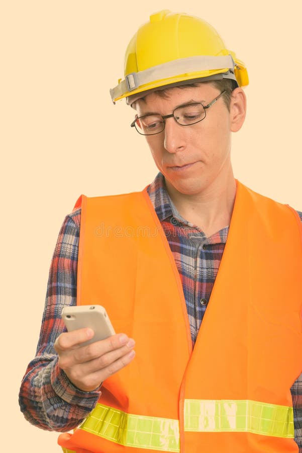 Studio Shot of Man Construction Worker Using Mobile Phone Stock Image ...