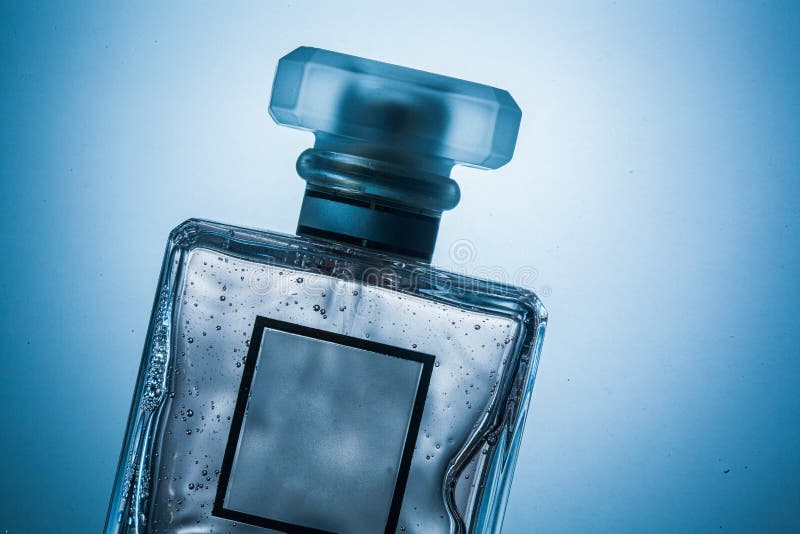 Backlit Perfume Bottle Shot in Studio Stock Photo - Image of liquid ...