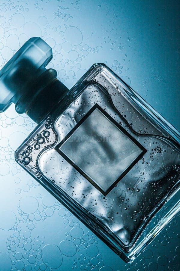 Backlit Perfume Bottle Shot in Studio Stock Photo - Image of bubbles ...