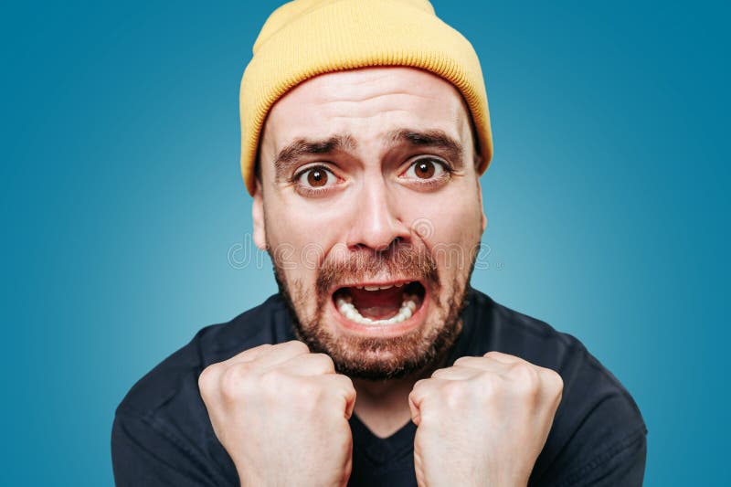 A Studio Shot of a Shouting Guy, His Expression One of Anger and ...
