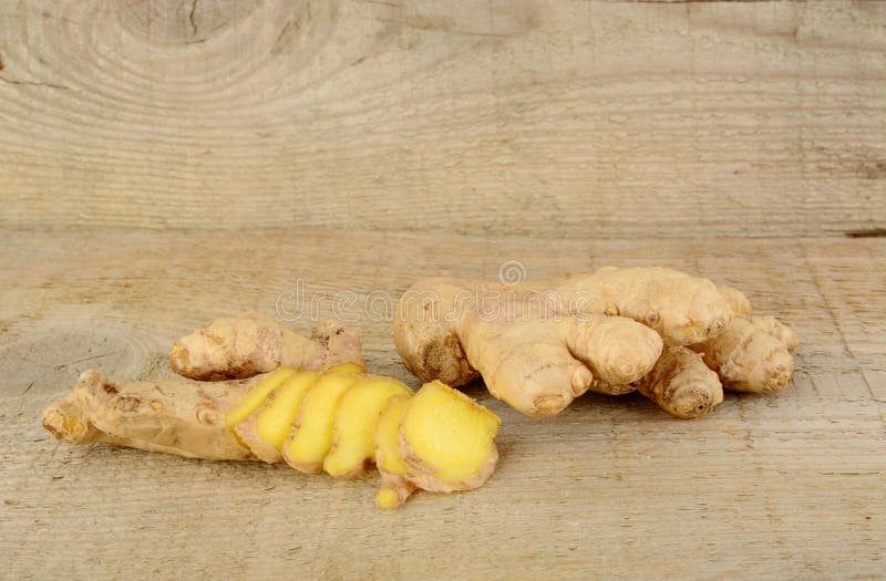 Studio Shot of Sliced Ginger Isolated on Wooden Table Stock Image ...