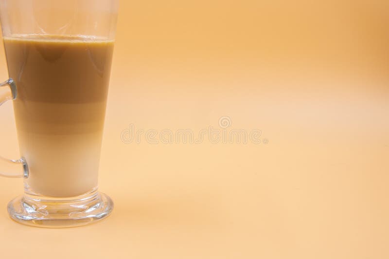 Studio Shot of Three Layered Tea in a Clear Glass with Orange Ombre ...