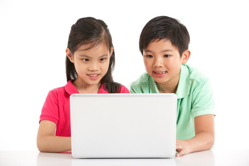 Studio Shot of Two Chinese Children with Laptop Stock Image - Image of ...