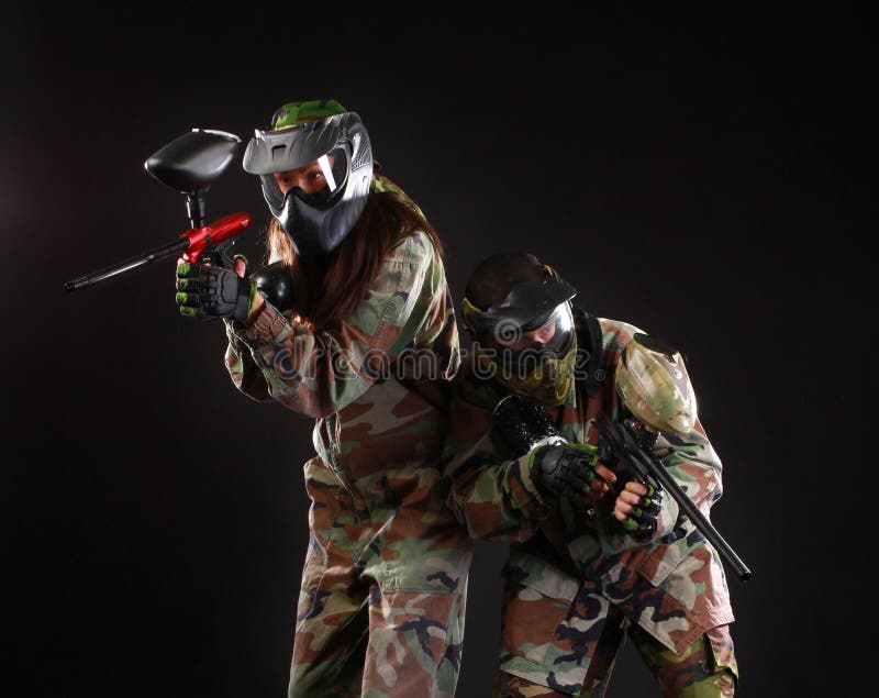 Studio Shot of Two Paintball Players Stock Photo - Image of cylinder ...