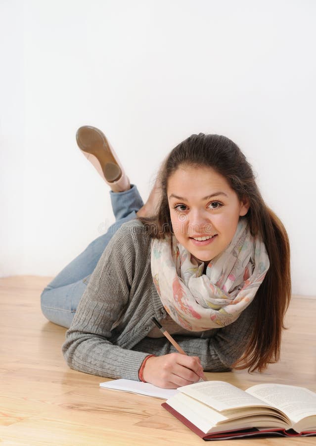 Studio Shot of a Woman Studying with Books and Notebook Stock Photo ...