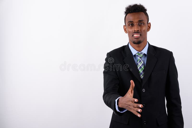 Young Bearded African Businessman Wearing Suit Against White Bac Stock ... Young Bearded African Businessman Wearing Suit Against White Bac Stock ...