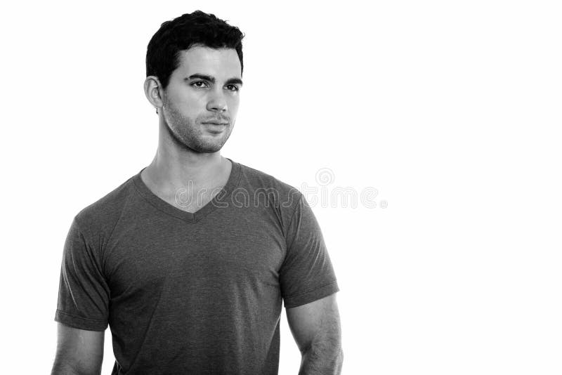 Studio Shot of Young Handsome Hispanic Man Thinking while Looking at ...