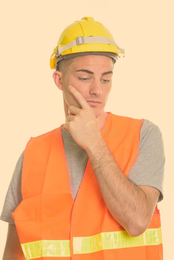 Studio Shot of Young Handsome Man Construction Worker Thinking Stock ...