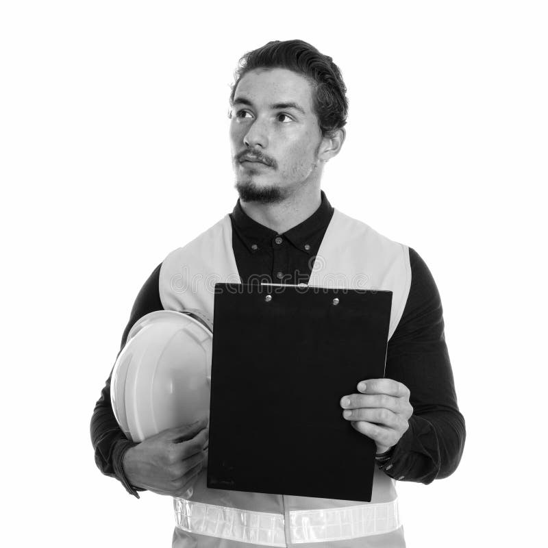 Studio Shot of Young Handsome Man Construction Worker Holding Hard Hat ...